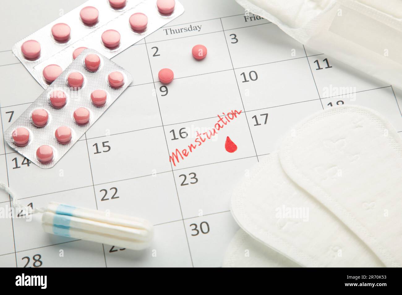 Menstruation calendar with cotton tampons and pads. Woman critical days ...