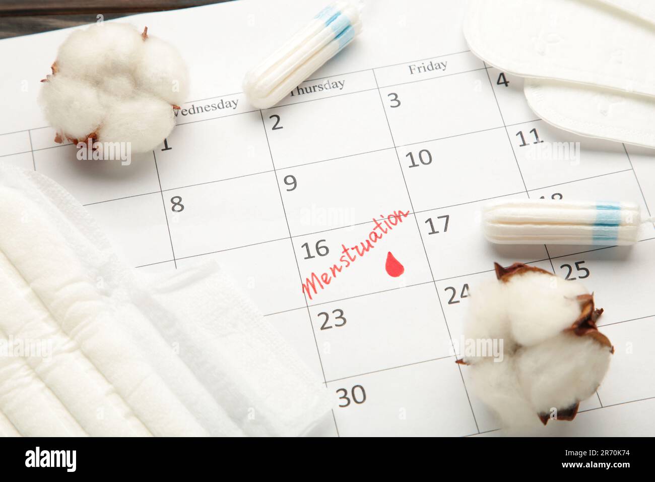 Menstruation calendar with cotton tampons and pads. Woman critical days ...