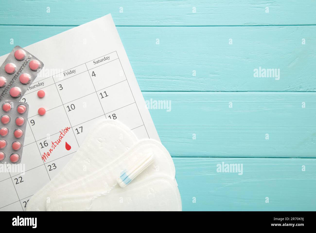 Menstruation calendar with cotton tampons and pads. Woman critical days ...
