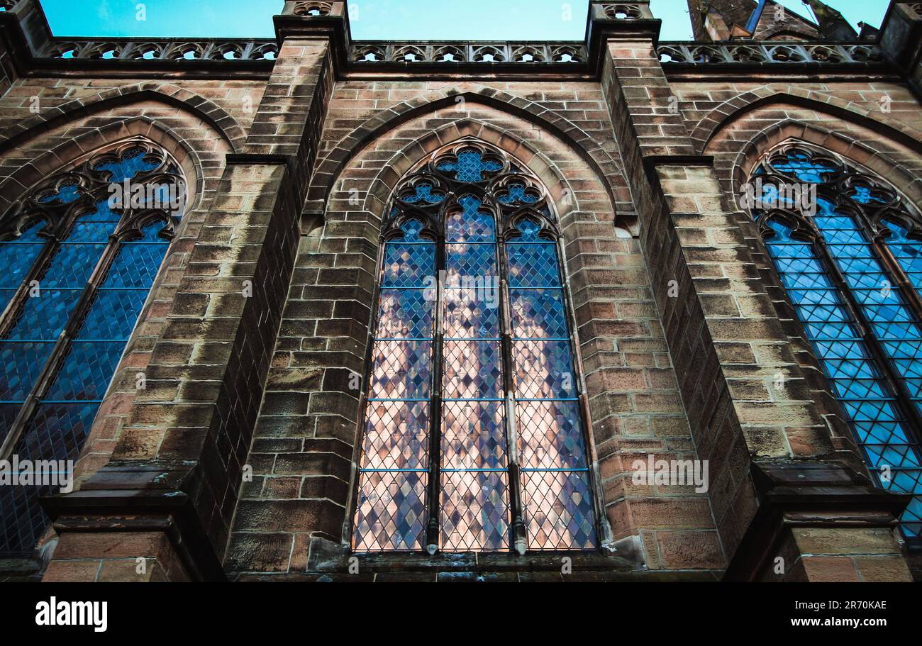 facade of an old cathedral with stone walls and windows Stock Photo - Alamy