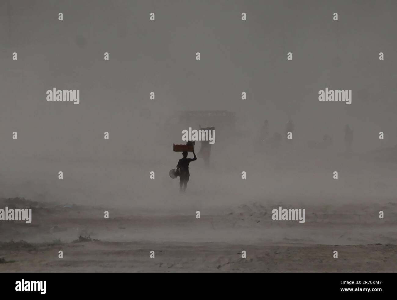 Prayagraj, India. 12/06/2023, Indian people brave heat wave and dust ...