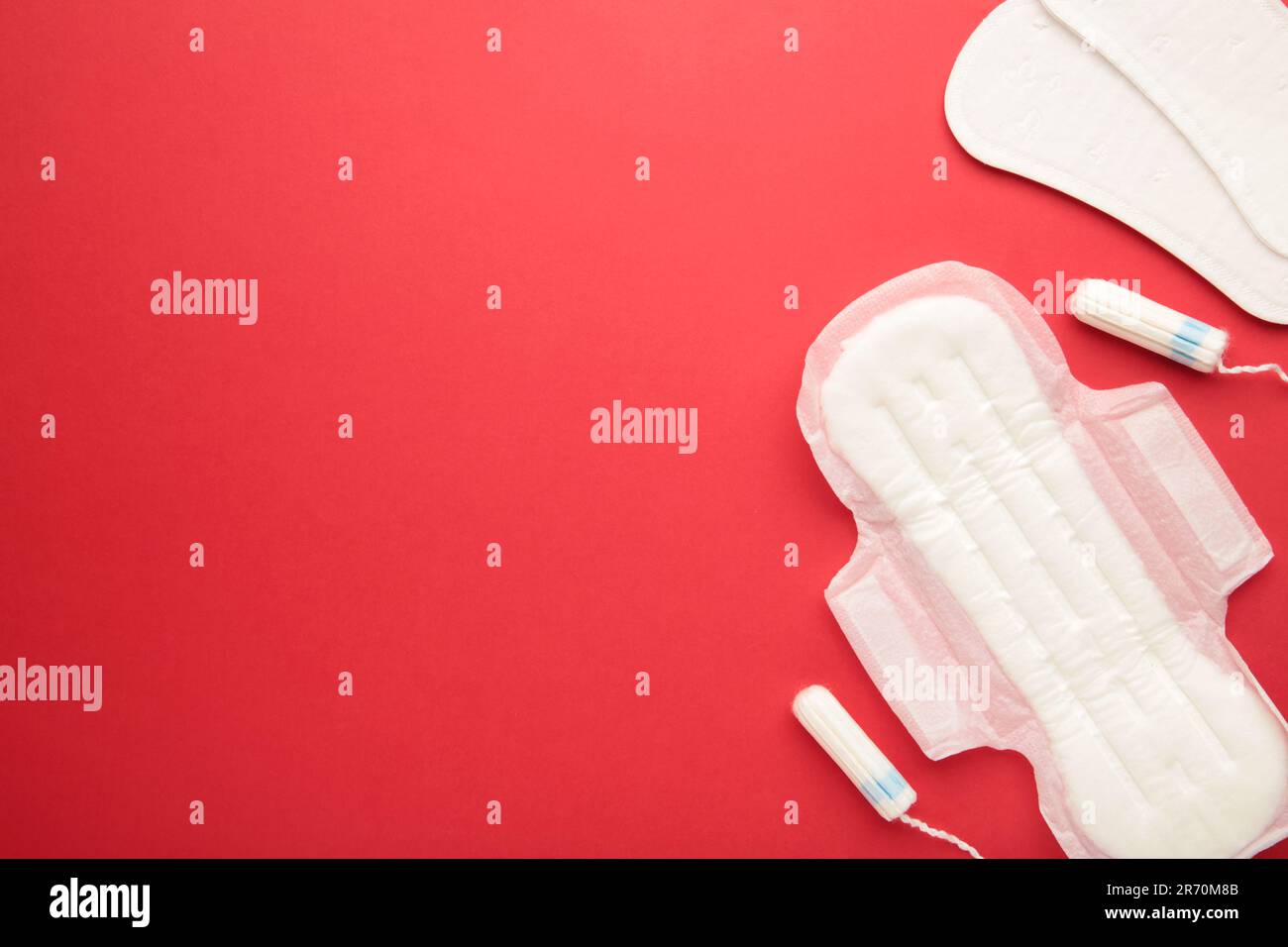 Menstrual tampons and pads on a red background. Menstruation cycle ...