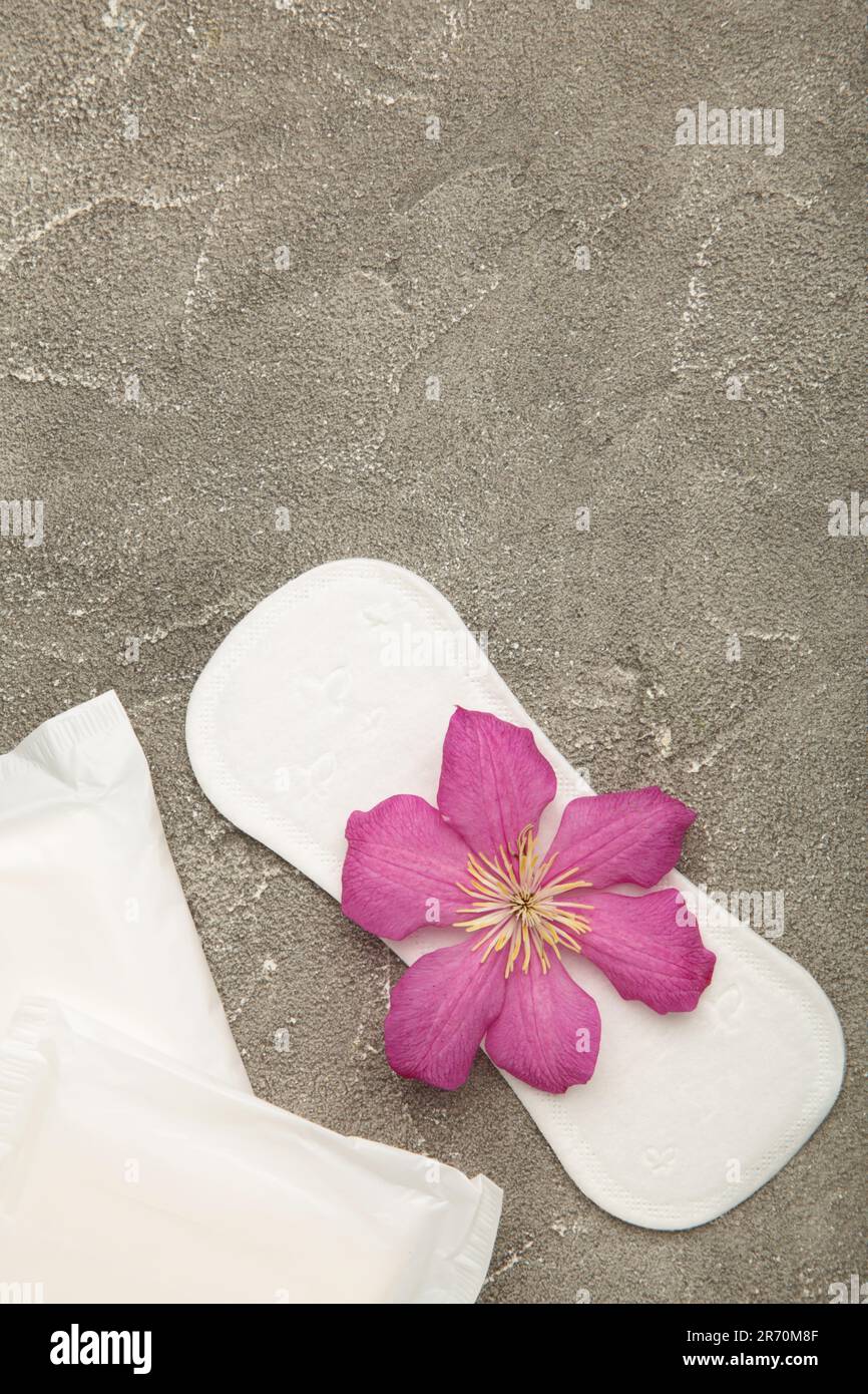 White sanitary pad, hygiene protection on a grey background ...