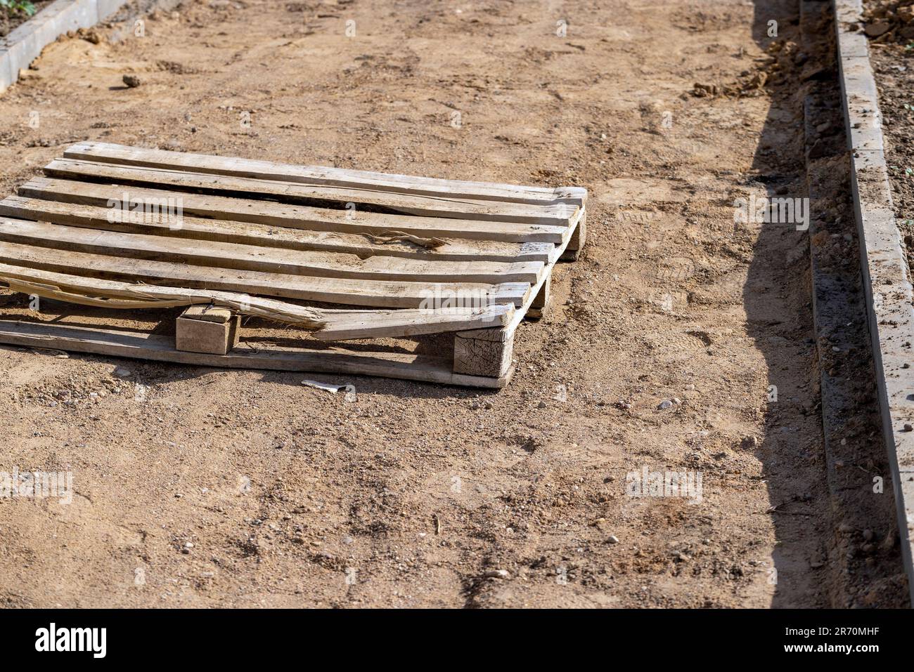 Construction of a new walkway in the park, installed curbs in the ...