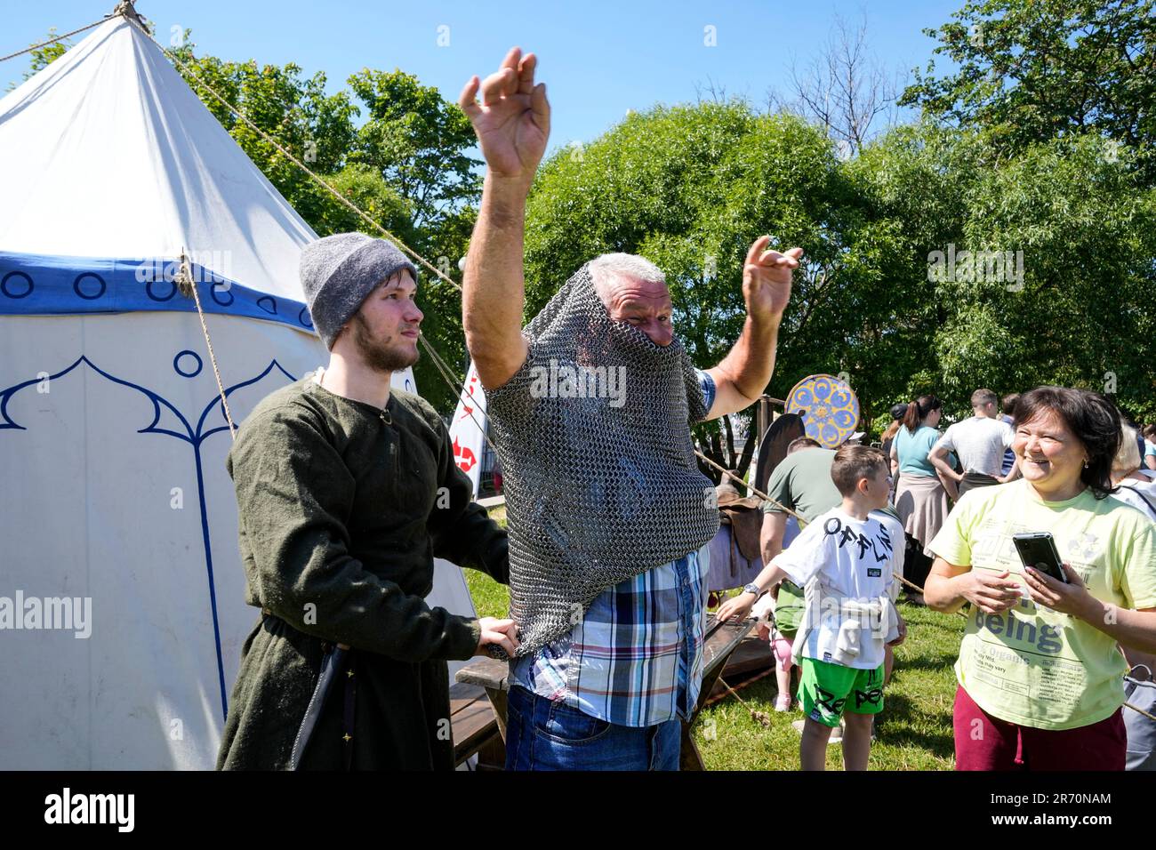 A man tries on a Russian medieval chain armor during celebrations ...