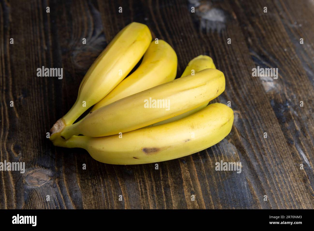 Ripe yellow bananas on the table, a bunch of ripe delicious bananas on ...