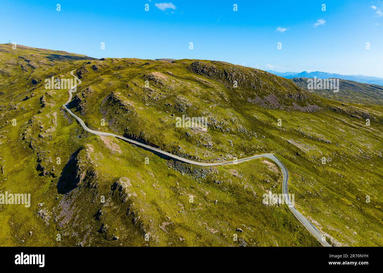 Aerial view of single track road passing through Bealach na Bà pass on ...