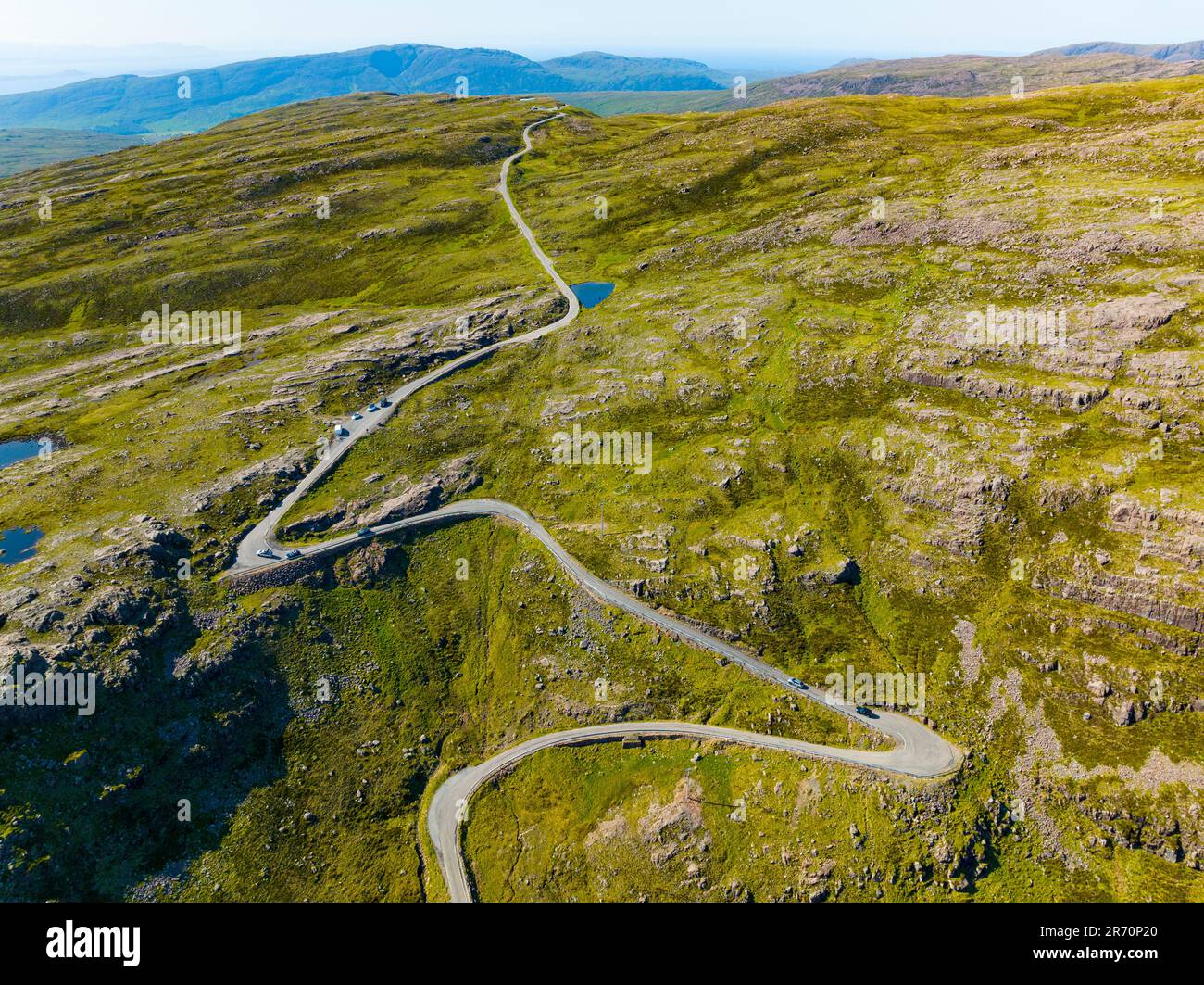 Aerial view of single track road passing through Bealach na Bà pass on ...