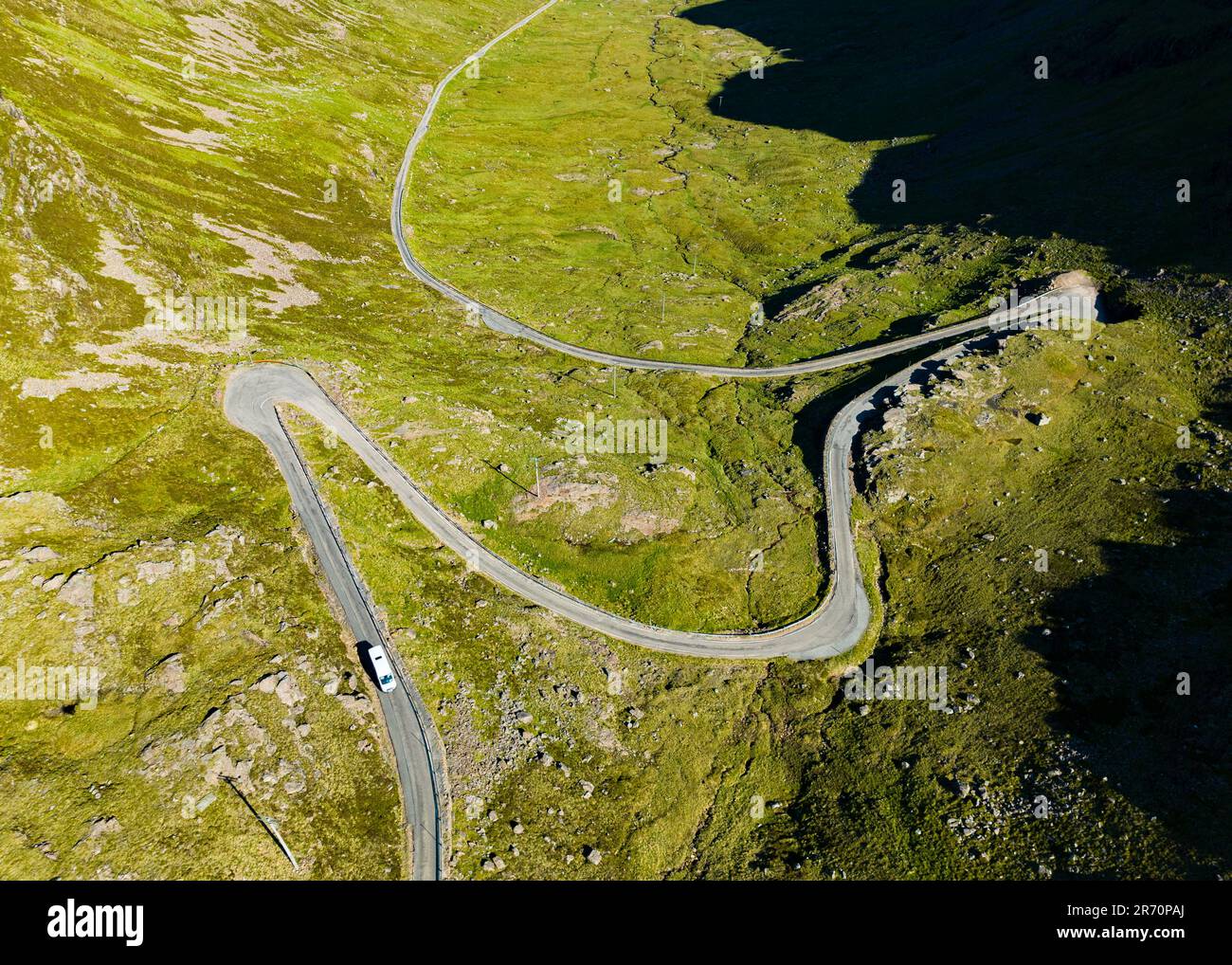 Aerial view of single track road passing through Bealach na Bà pass on ...