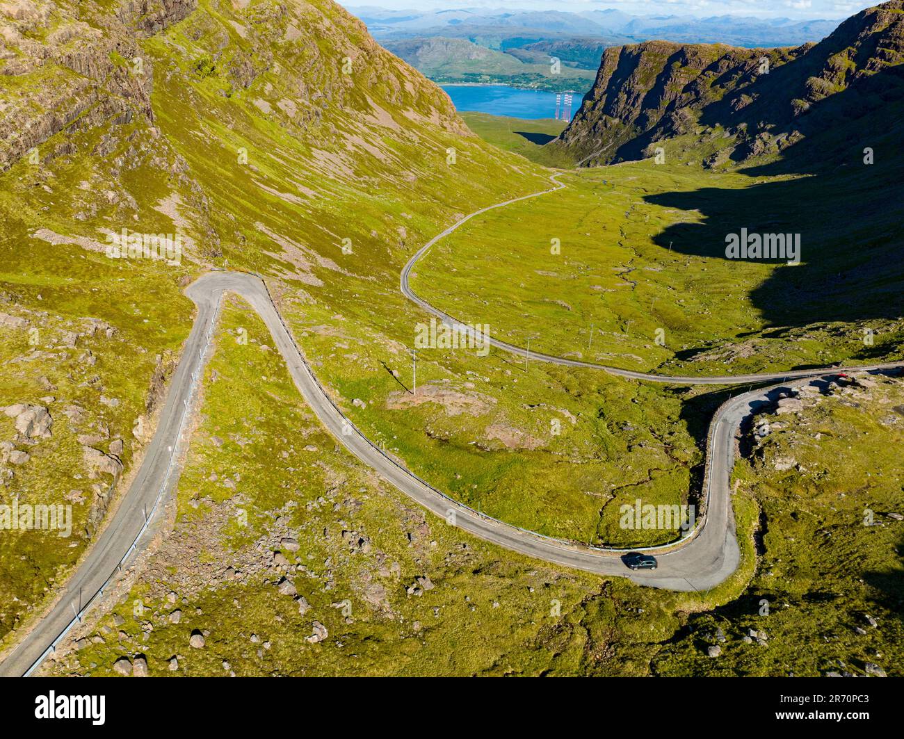 Aerial view of single track road passing through Bealach na Bà pass on ...
