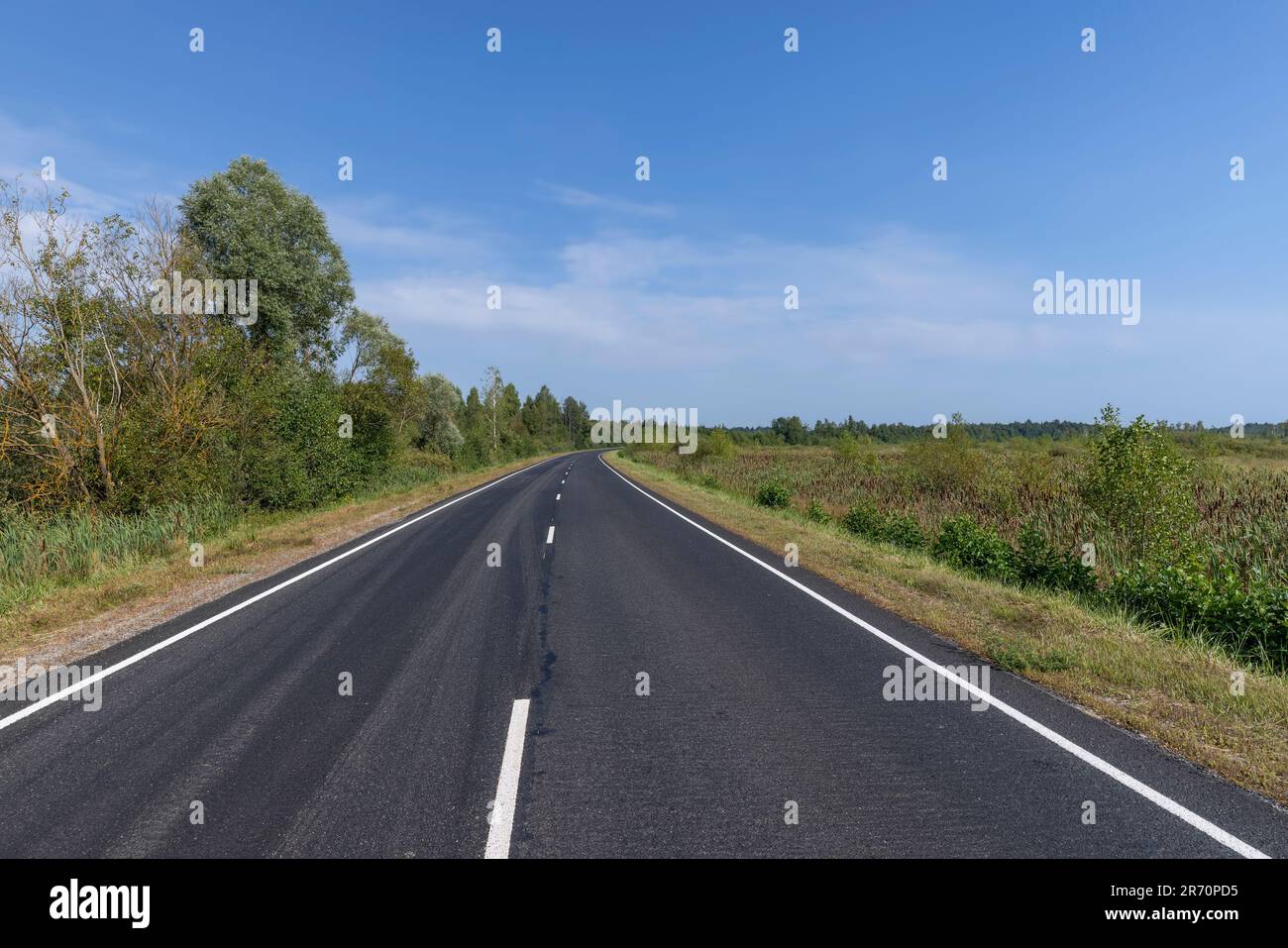 Narrow paved road for cars, part of a modern paved expressway for motor ...
