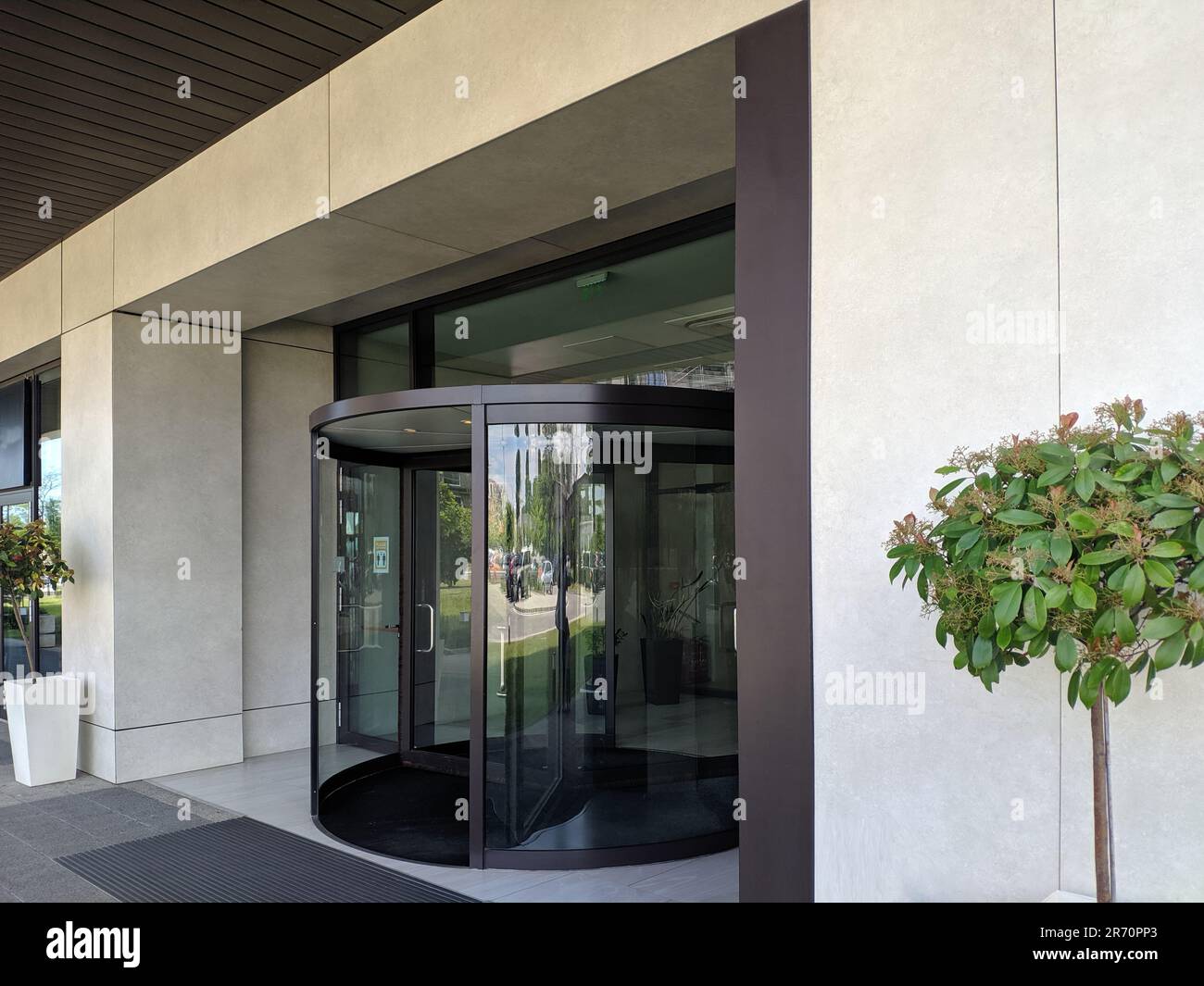 Automatic modern black rotating doors office mockup Stock Photo - Alamy