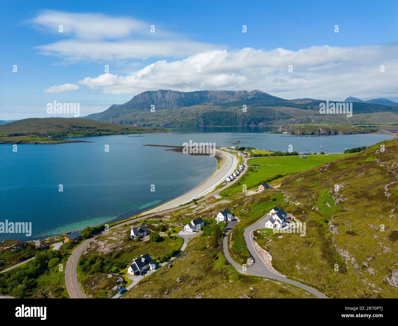 Aerial view of village of Ardmair with mountains of Coigach to rear ...