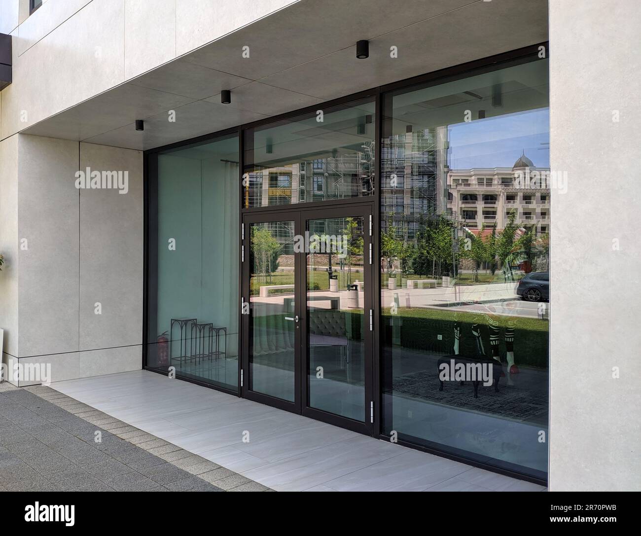 Glass partition mockup and modern doors in hall Stock Photo - Alamy
