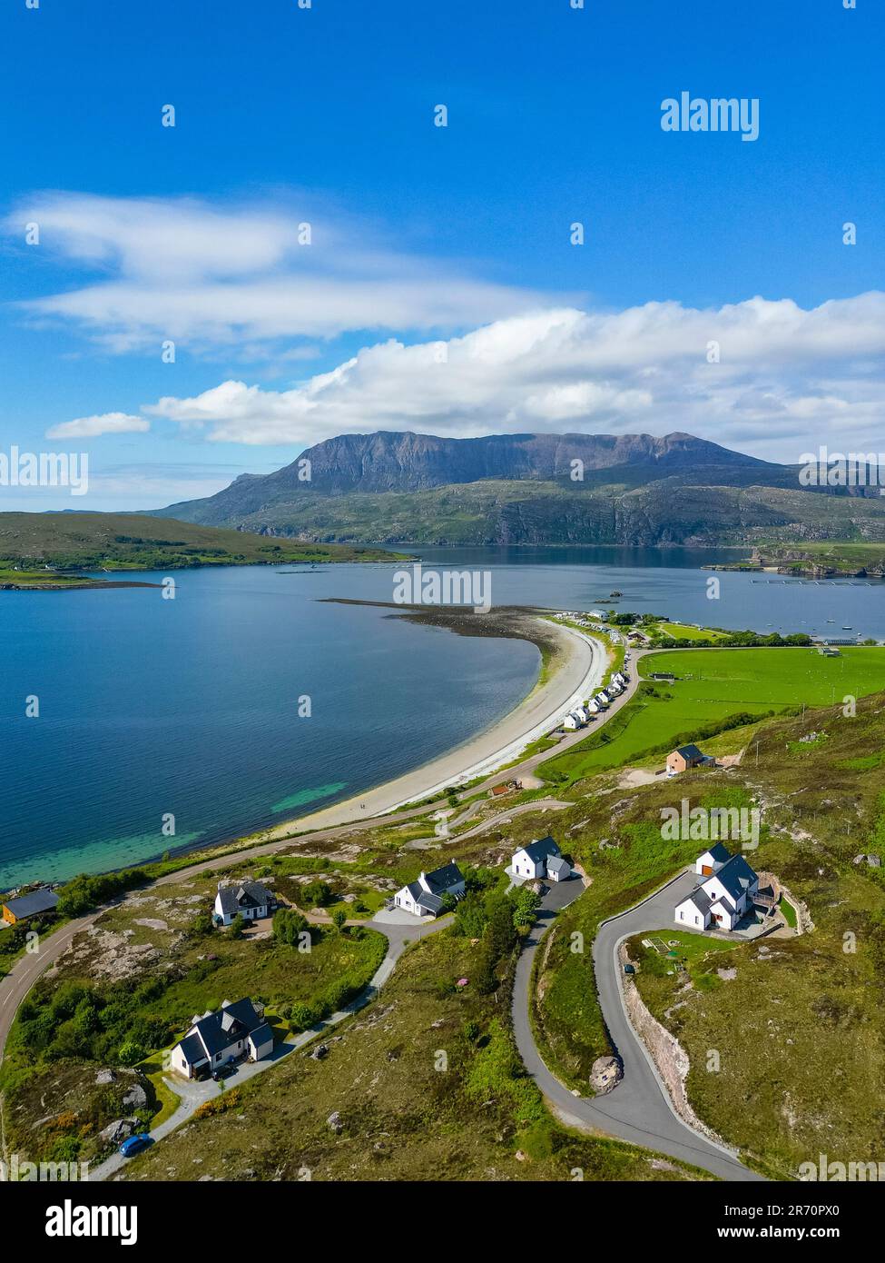 Aerial view of village of Ardmair with mountains of Coigach to rear ...