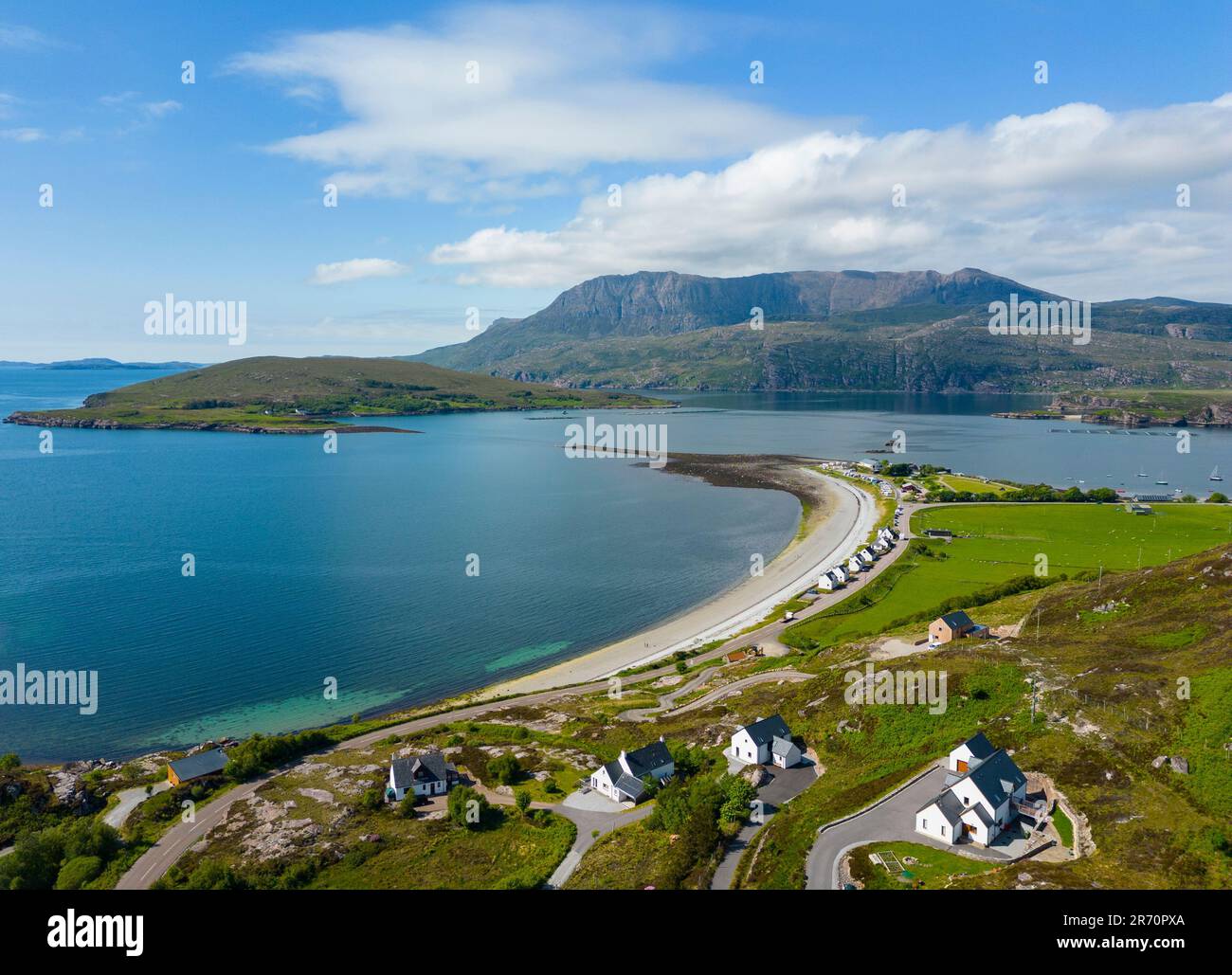 Aerial view of village of Ardmair with mountains of Coigach to rear ...