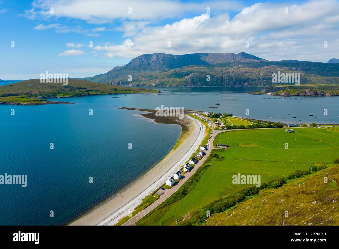 Aerial view of village of Ardmair with mountains of Coigach to rear ...