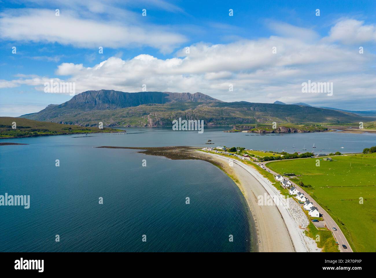 Aerial view of village of Ardmair with mountains of Coigach to rear ...