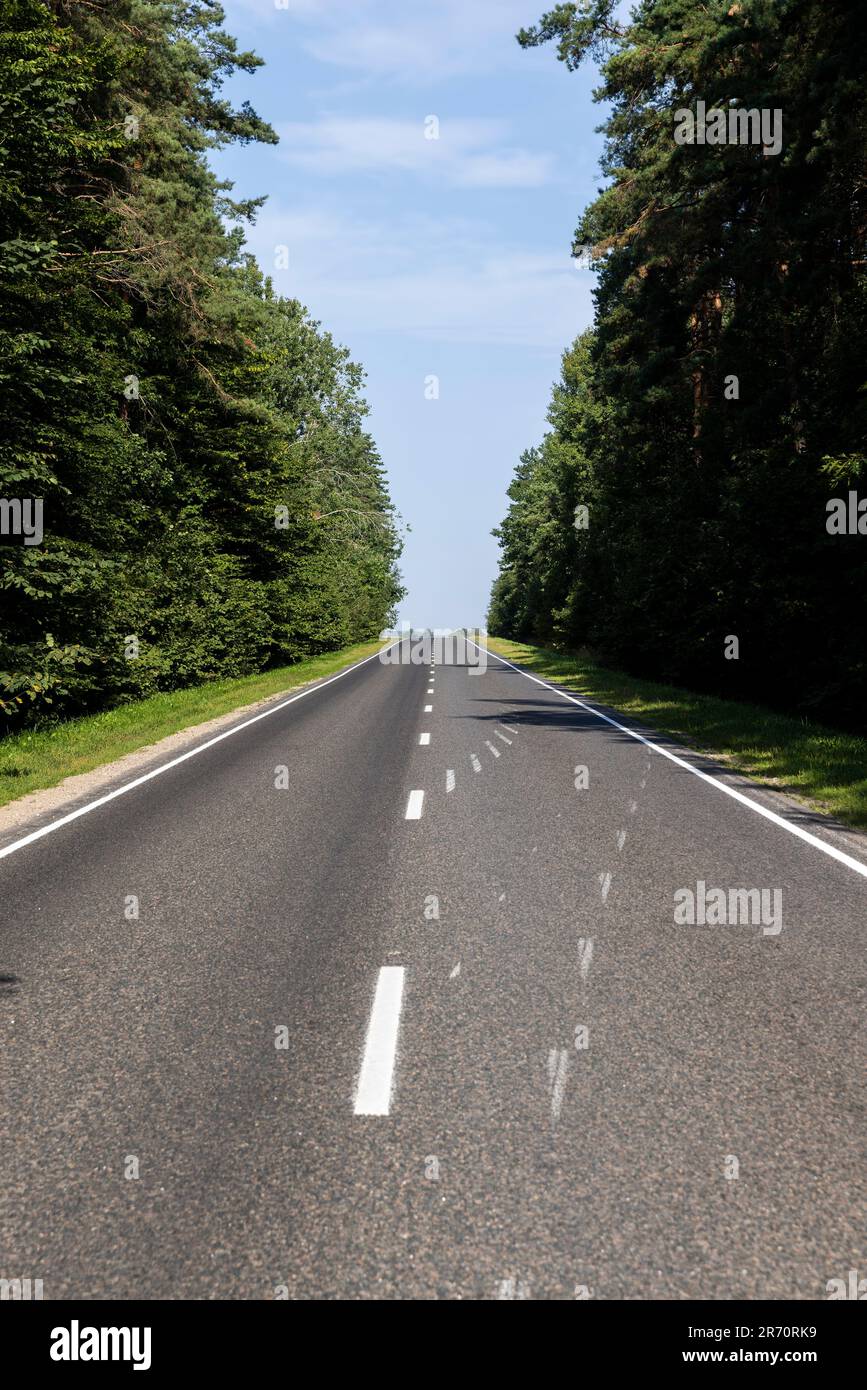 Narrow paved road for cars, part of a modern paved expressway for motor ...