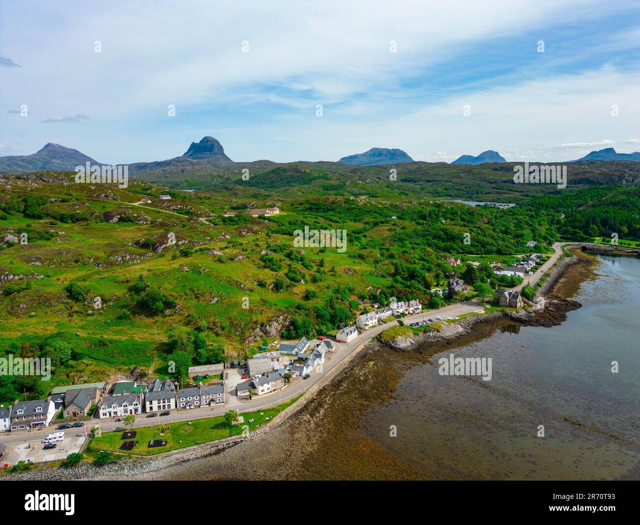 Aerial view of village of Lochinver with mountains of Assynt/Coigach in ...
