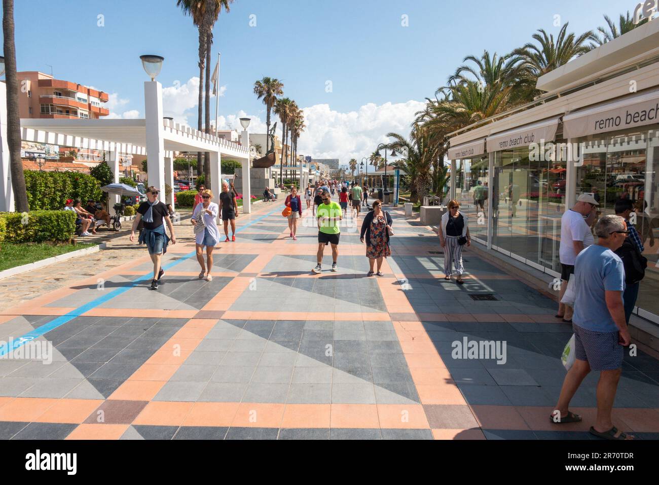 Carihuela, Torremolinos Spain, tourists walking along the waterfront ...