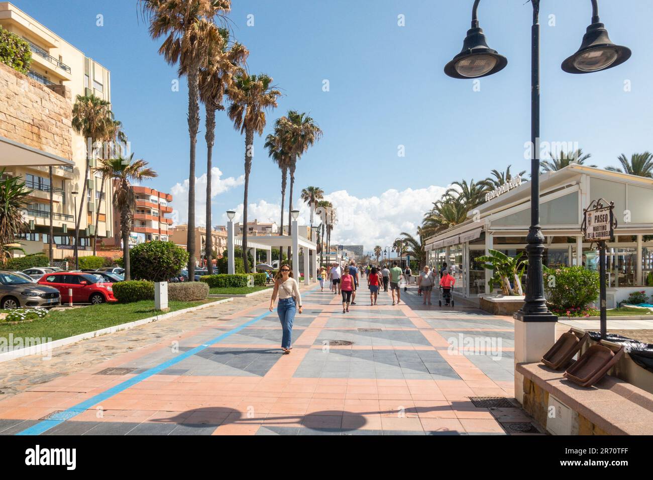 Carihuela, Torremolinos Spain, tourists walking along the waterfront ...