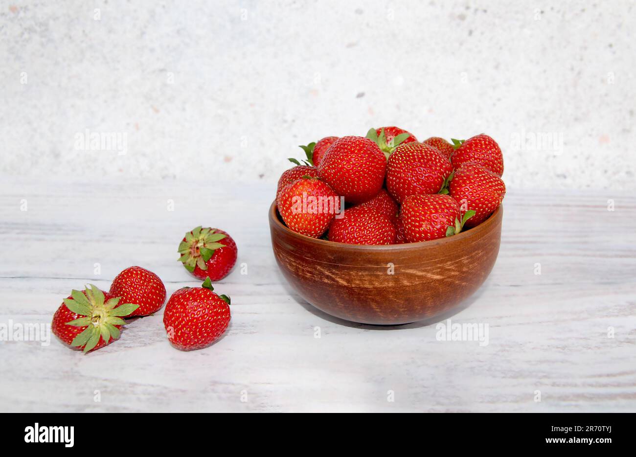 Strawberries in bow on white table top view. Beautiful red strawberry ...