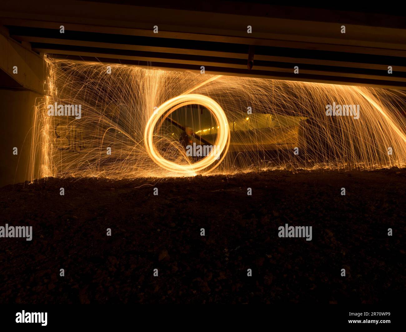 A burning steel wool spinning creates showers of glowing sparks Stock ...