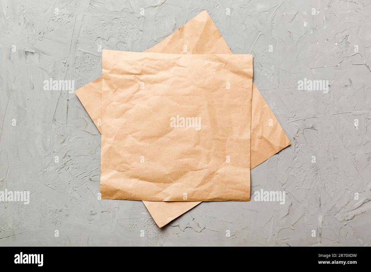 top view with baking parchment empty on table background. Folded cloth ...