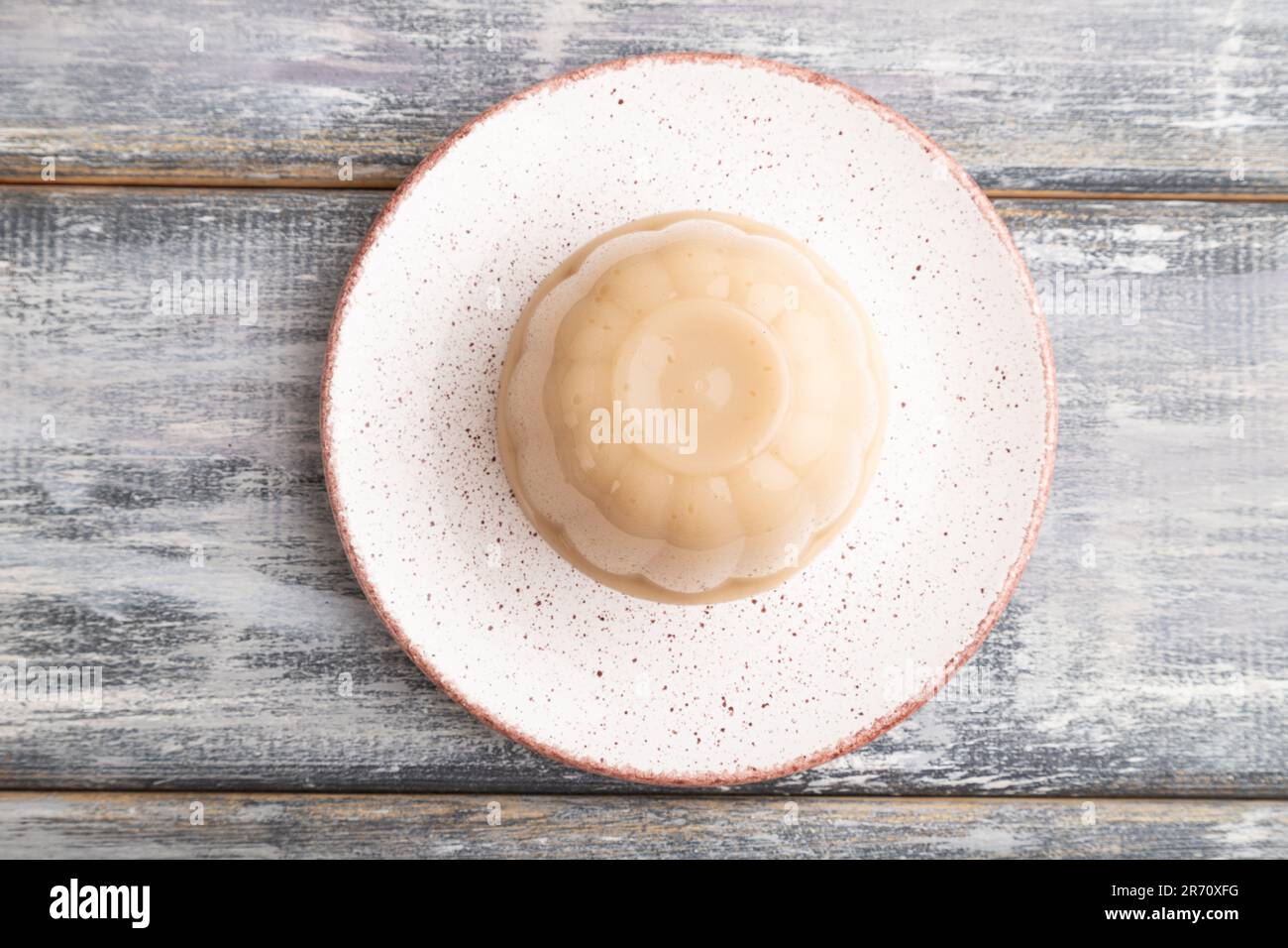 Buckwheat milk jelly on gray wooden background. top view, flat lay ...