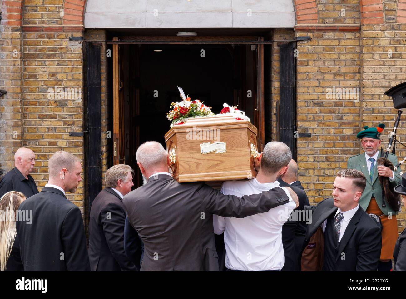 The the coffin of Hugh Callaghan is carried into The Immacutate Heart ...