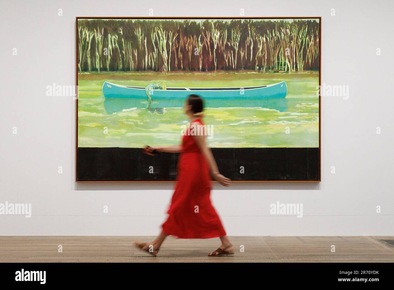 A person walks past Peter Doig's Canoe Lake, 1997, during a photo call ...