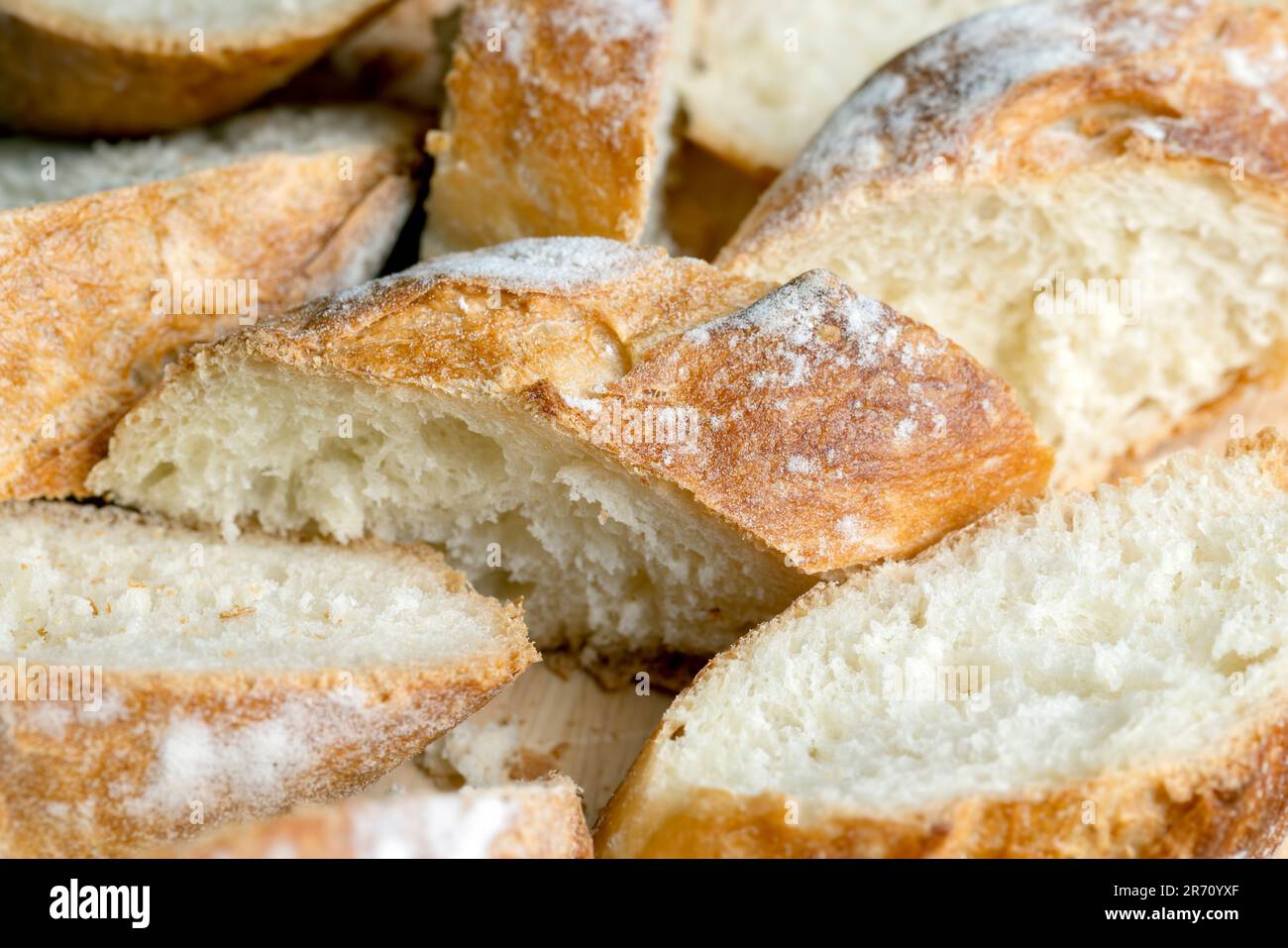 Sliced wheat bread into pieces, white traditional wheat bread with ...