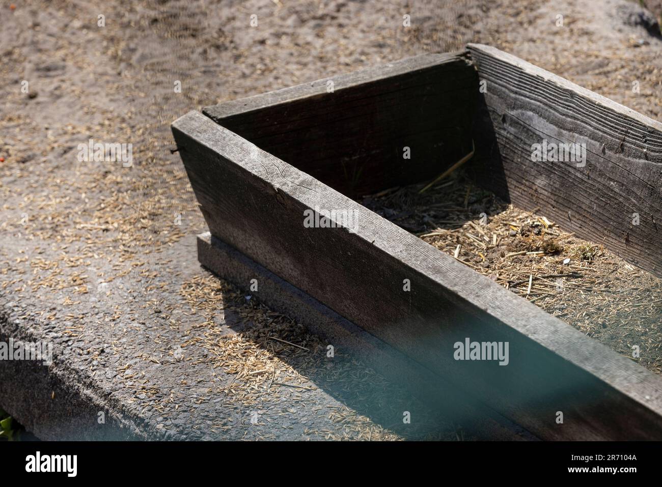 Wooden trough in the park for feeding herbivores, an old wooden trough ...