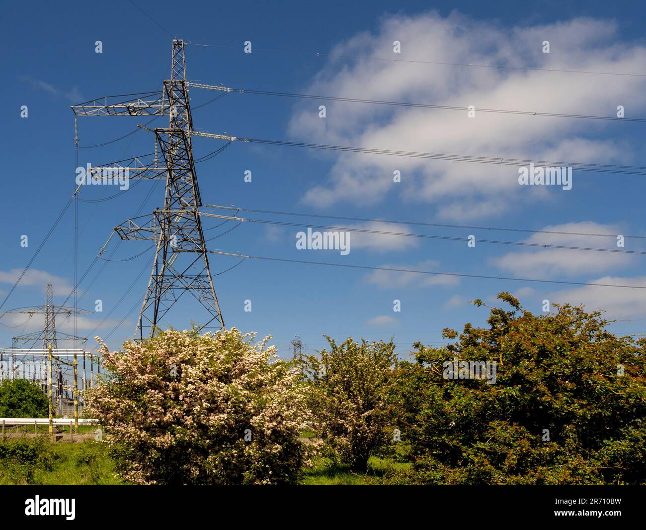 Pylons at the National Grid Salthome Substation seen against a blue sky ...