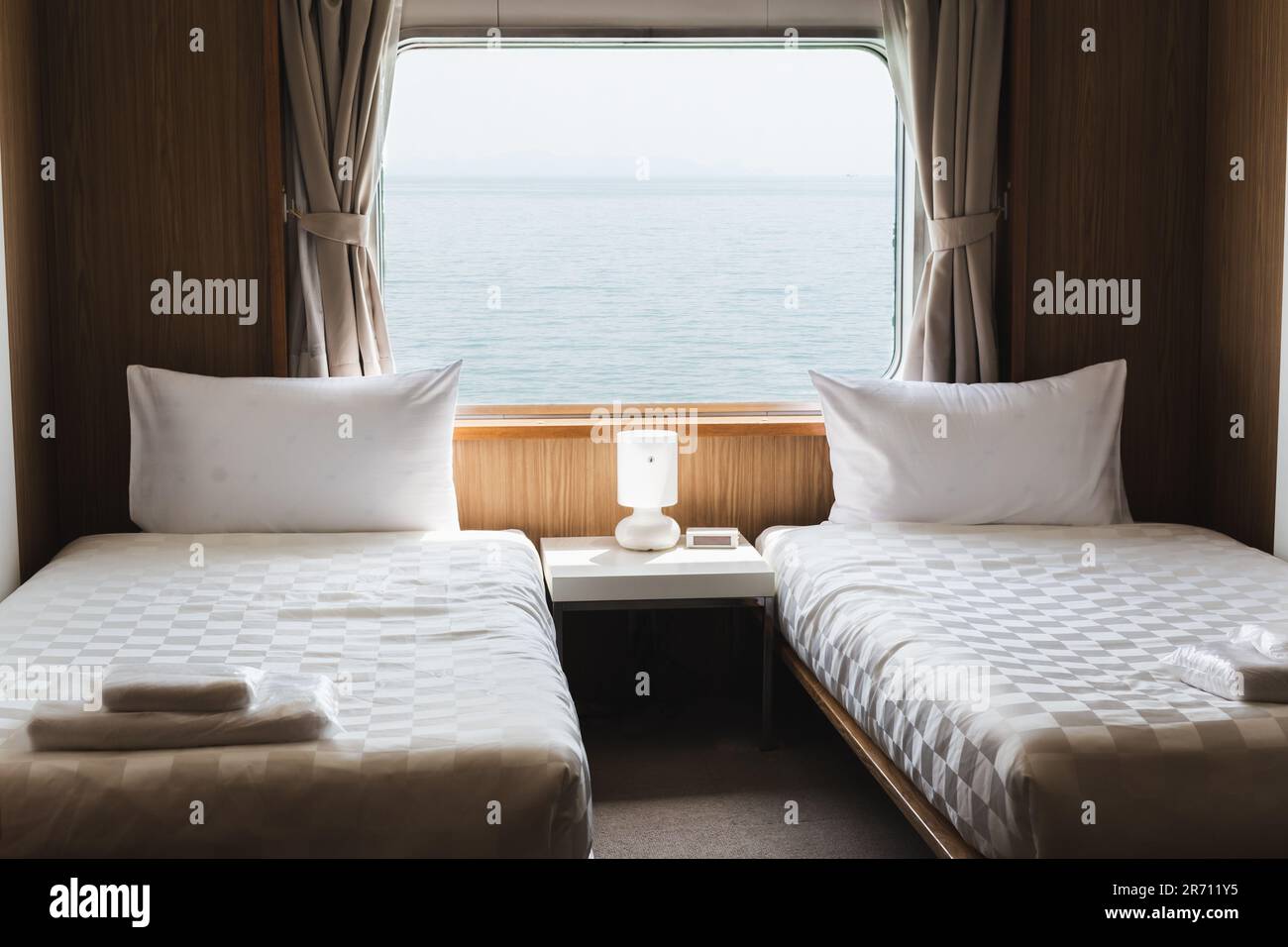 Bedroom with interior of double passenger cabin ferry ship with ocean ...
