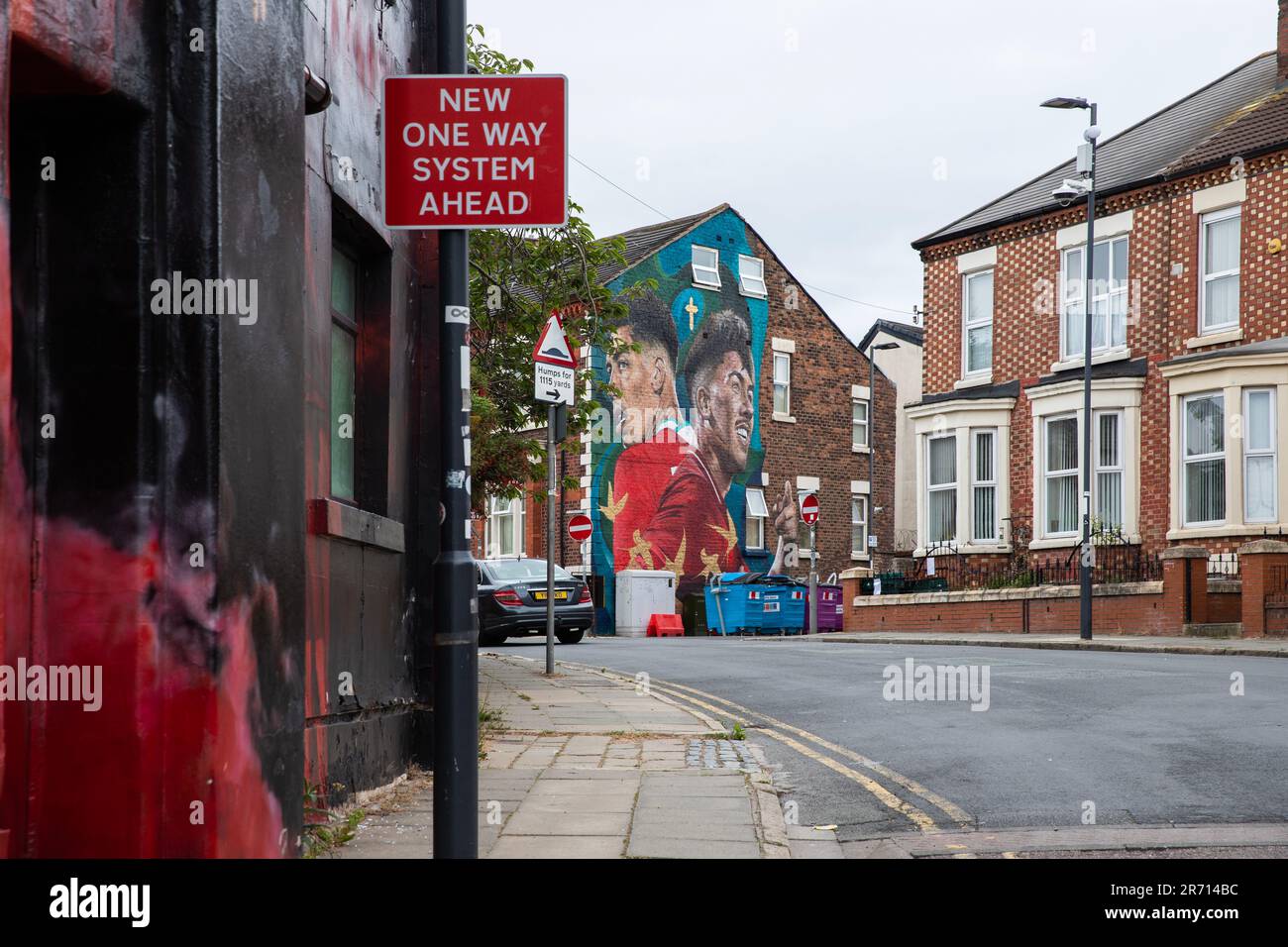 View down Anfield Road, towards a mural of Liverpool FC striker Roberto ...
