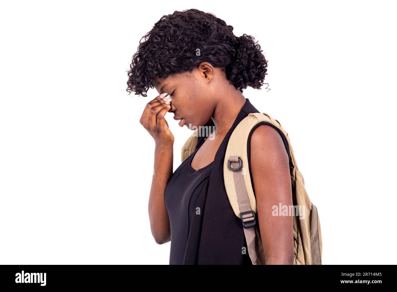 young student girl with backpack standing on white background feeling ...