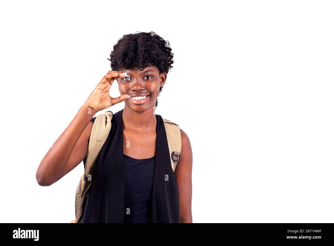 young happy student girl carrying backpack and making small-size ...
