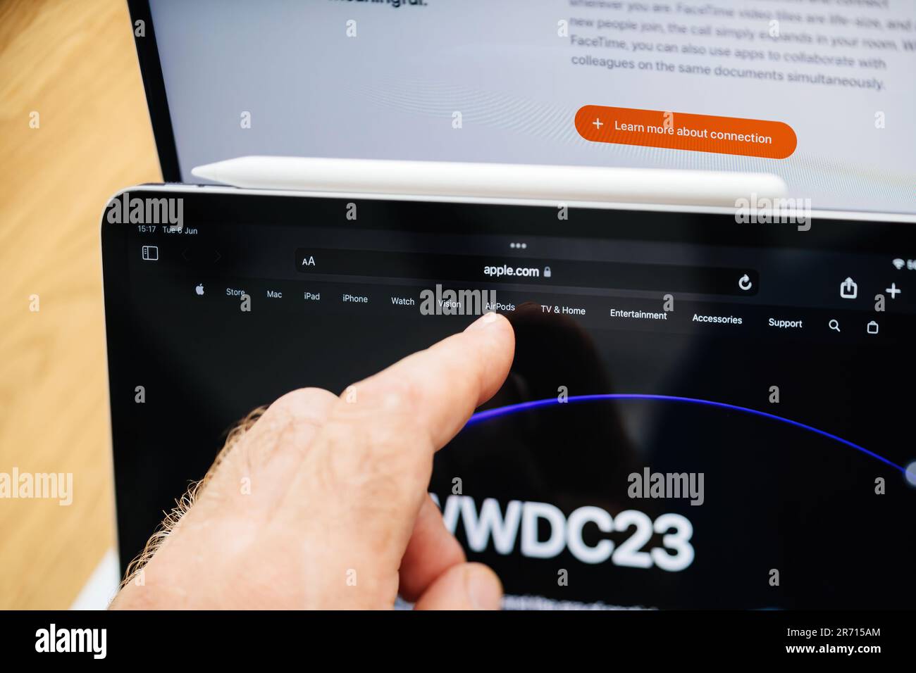 Paris, France - Jun 6, 2023: Hand poitning to Airpods menu next to ...