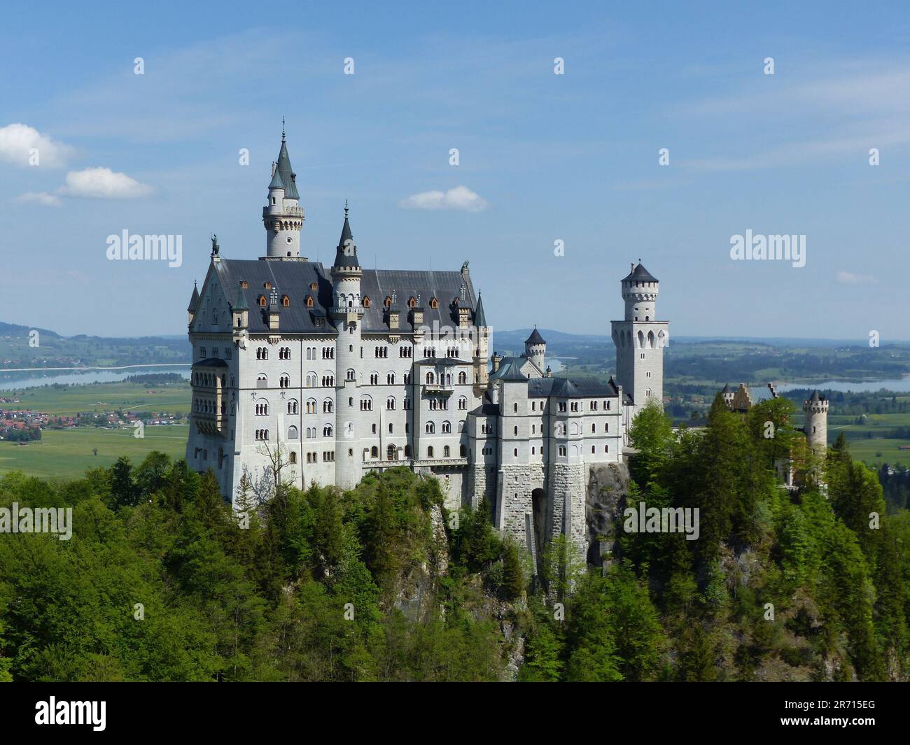 An enchanting view of an ancient castle situated in a serene green ...