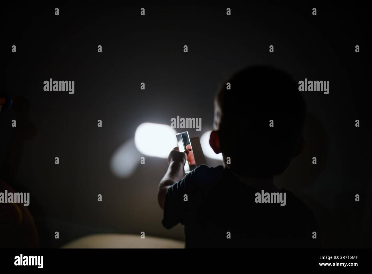 Child holds crystal glass prism reflecting shiny, 3D sphere. Curiosity ...