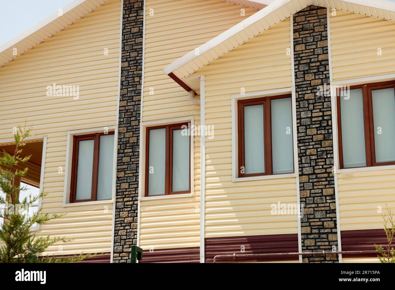 Two-storey house with garden. Exterior Cladding Stock Photo - Alamy