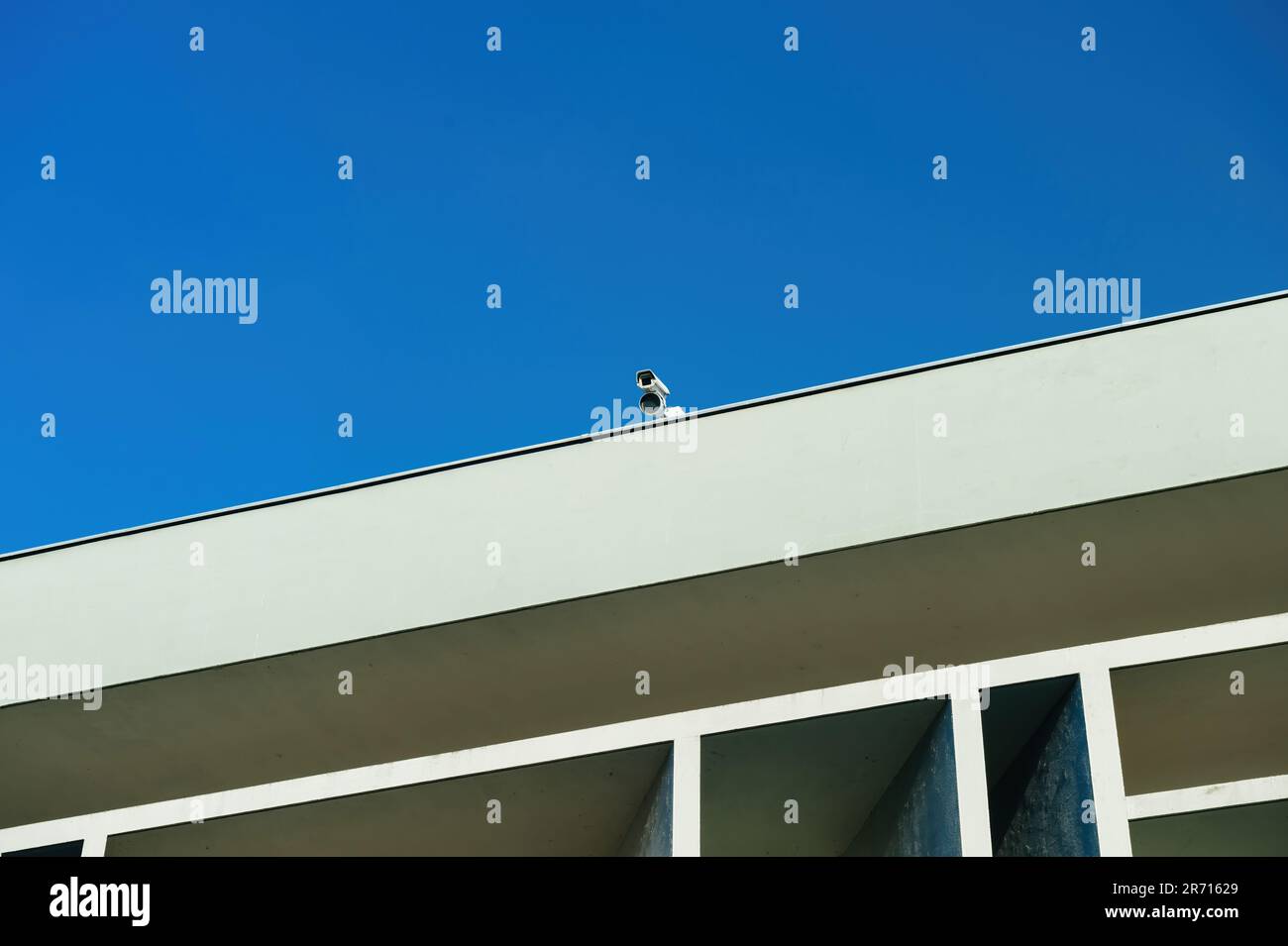 A conceptual roof with CCTV cameras overlooks architecture below, the ...