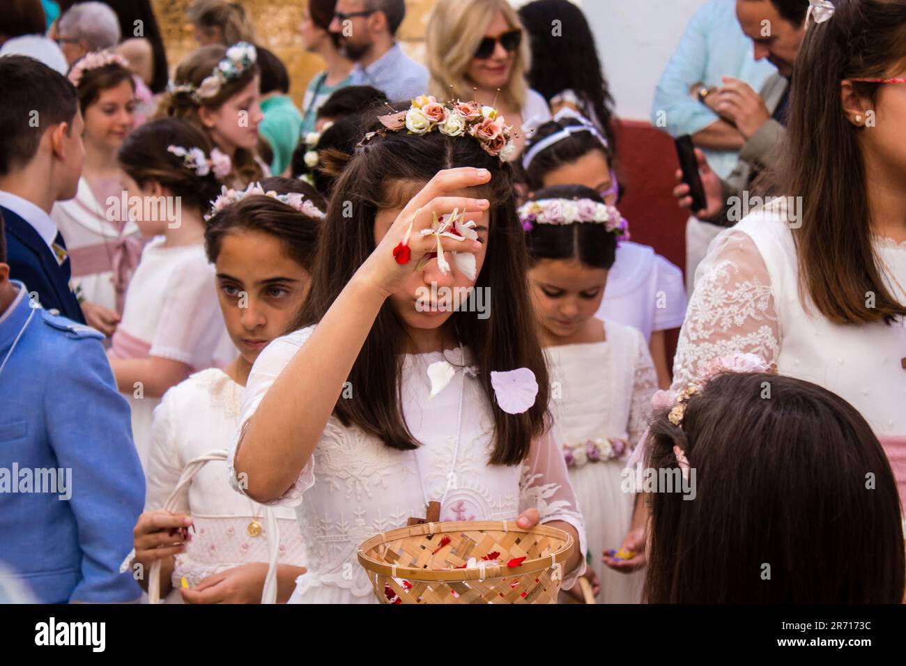 Young children participating at the Corpus Christi procession, an age-old tradition of the ...