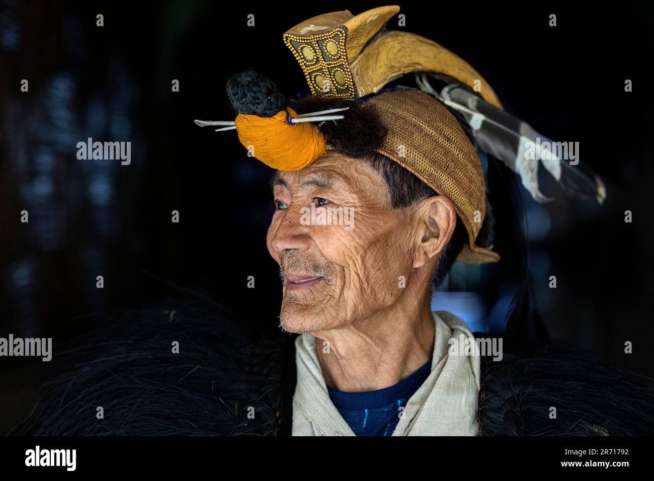 Portrait of a man Nyishi elder in his traditional tribal clothes with ...