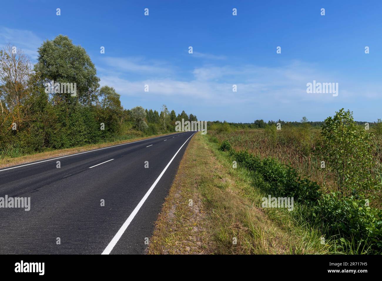 Narrow paved road for cars, part of a modern paved expressway for motor ...