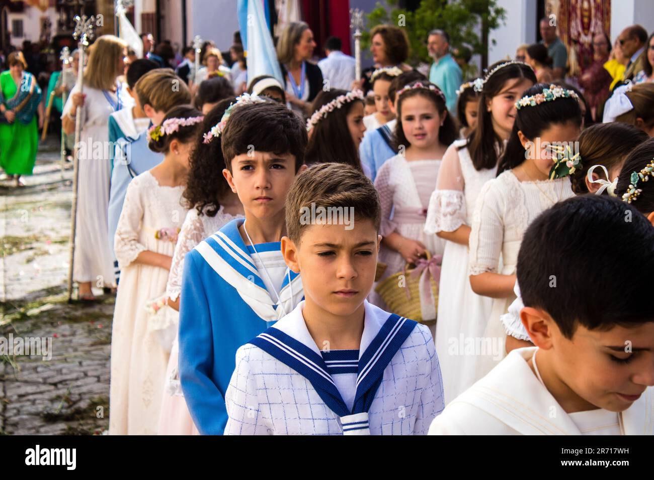 Young children participating at the Corpus Christi procession, an age ...