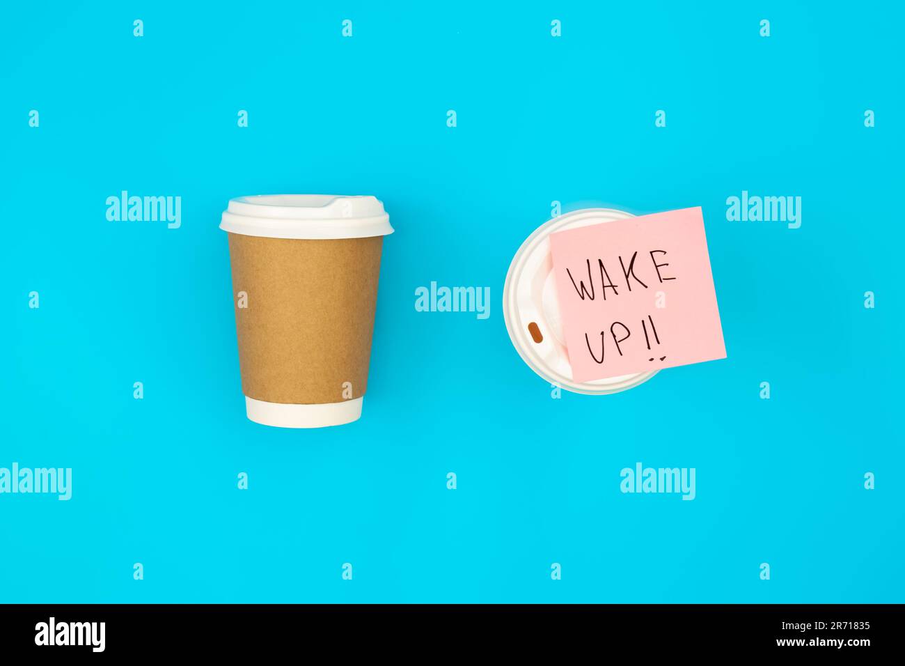 Paper disposable cups and paper reminder with text Wake up Stock Photo - Alamy