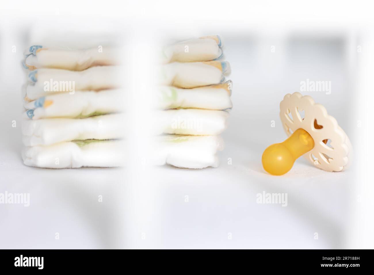 Baby's pacifier on a blurred white background Stock Photo - Alamy